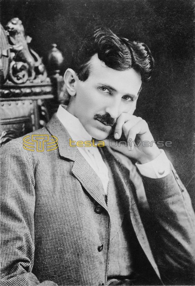 Famous portrait of Nikola Tesla seated in ornamental chair with hand to ...